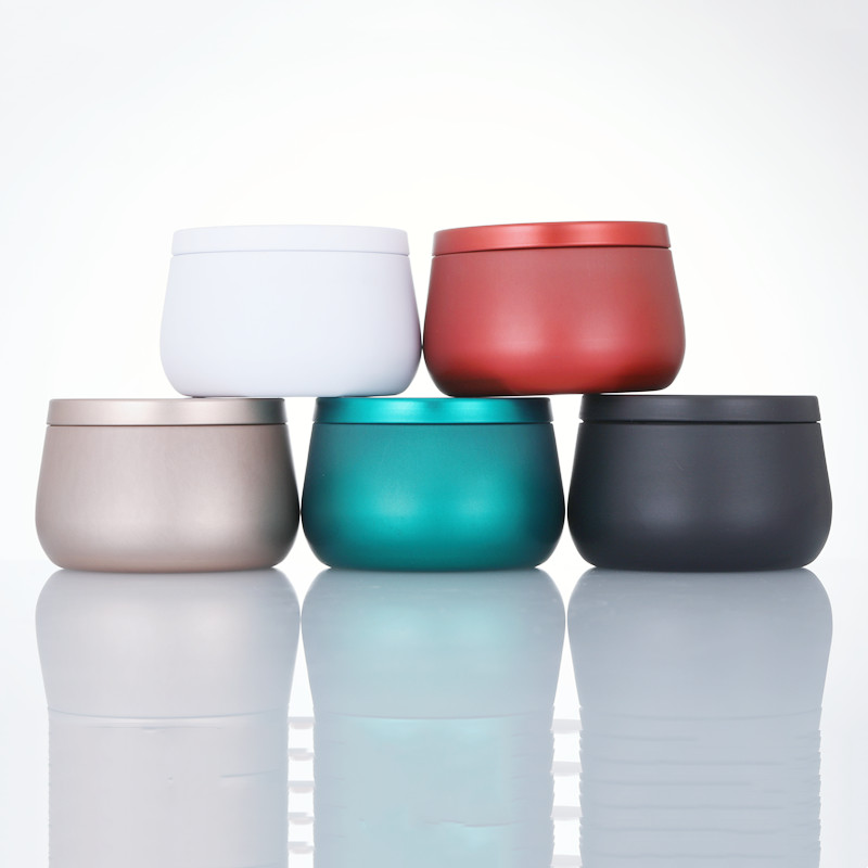 Large round metal candle jar