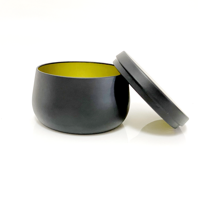 Round colored metal candle jar