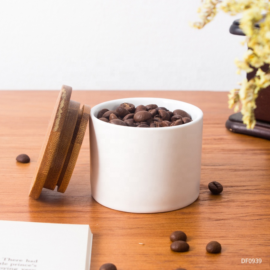 Small white ceramic candle jar